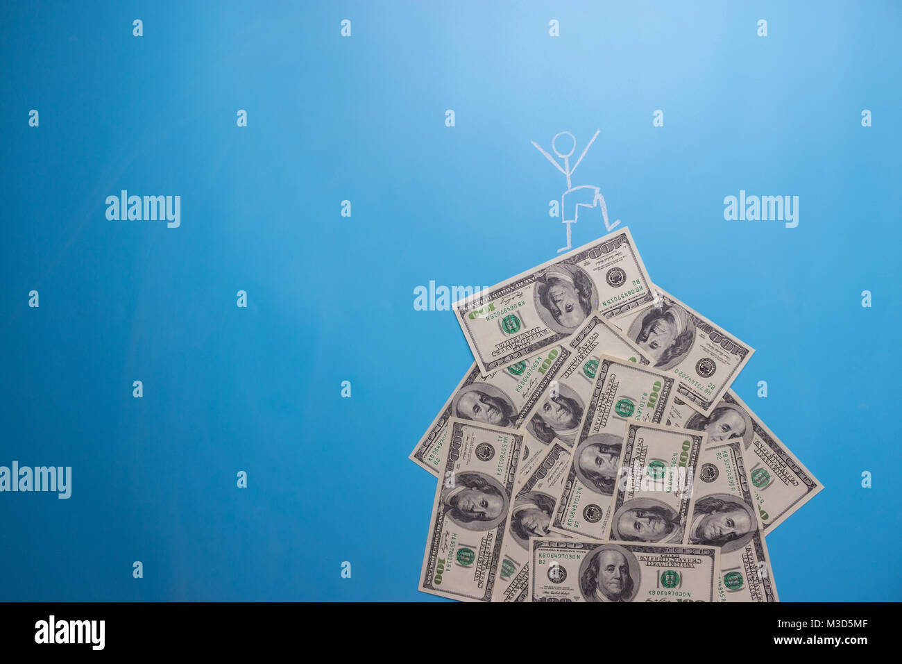 man standing on the dollars in a shape of a mountain. earn money ...