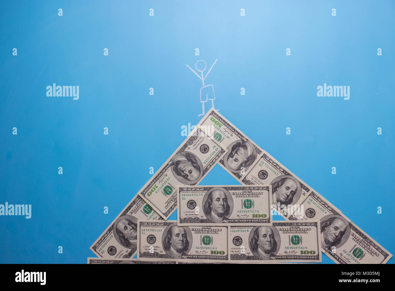 man standing on the dollars in a shape of a mountain. earn money ...