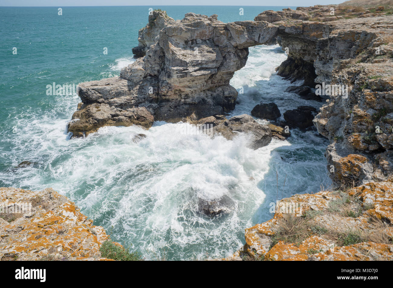 Waves pounding a beautiful rock shore of sea or ocean, Tyulenovo ...