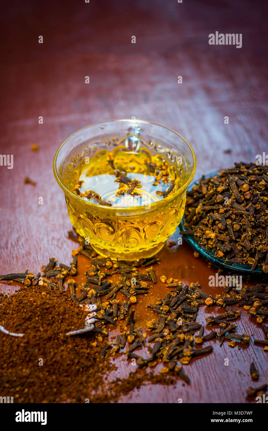 Close up of Clove,Syzygium aromaticum with its tea in a transparent cup ...