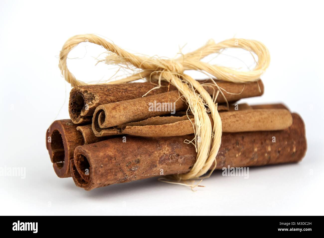 Cinnamon pieces on a white background. Sales of aromatic spices Stock ...