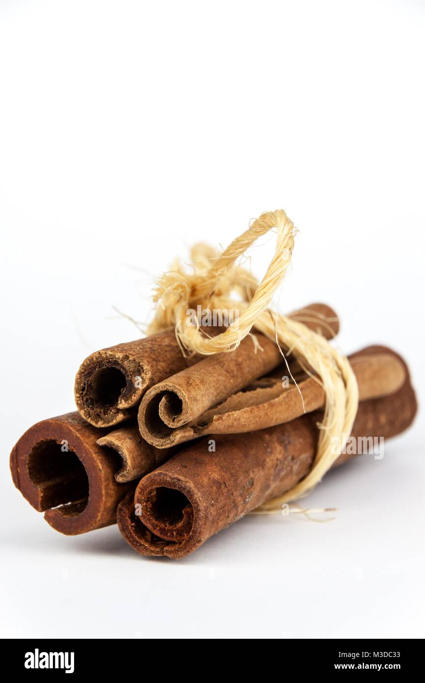Cinnamon pieces on a white background. Sales of aromatic spices Stock ...