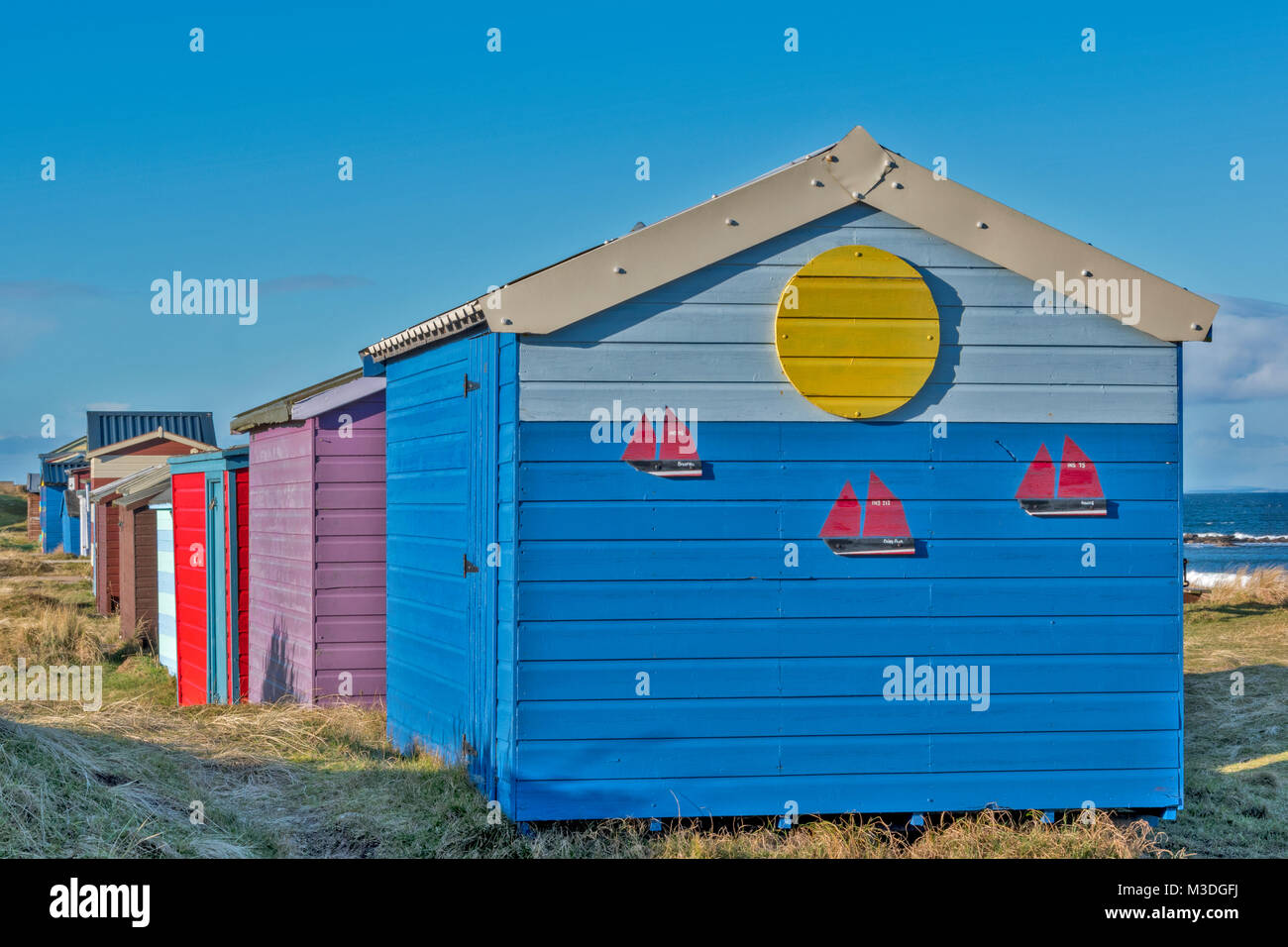 HOPEMAN MORAY SCOTLAND WINTER BEACH SCENE WITH ROW OF COLOURED BEACH ...