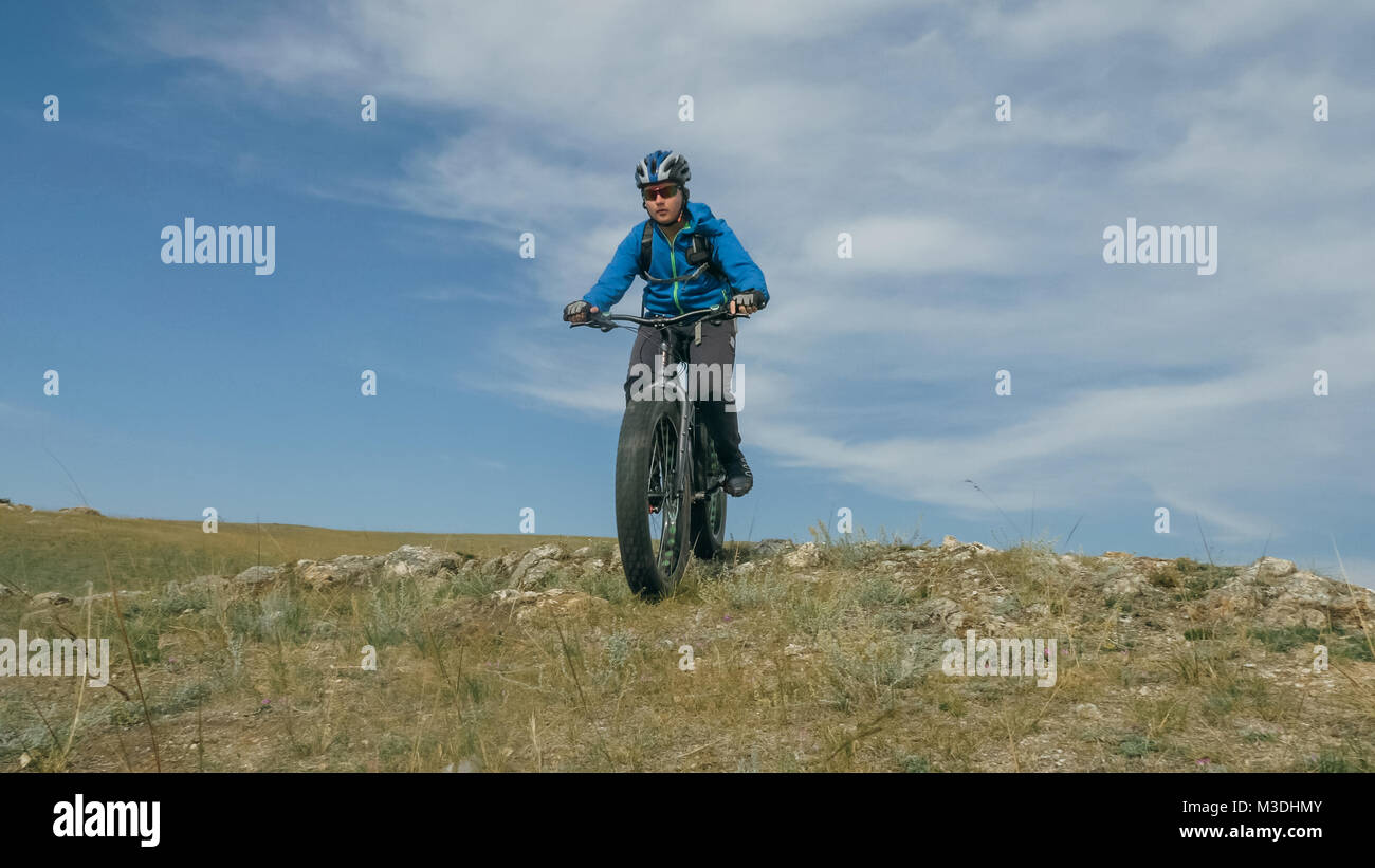 Fat bike also called fatbike or fat-tire bike in summer driving the ...