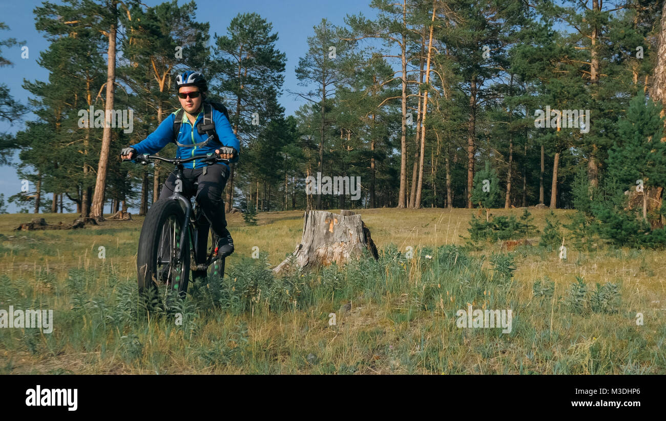 Fat bike also called fatbike or fat-tire bike in summer riding in the ...