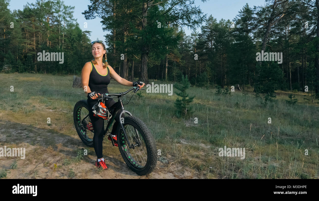 Fat bike also called fatbike or fat-tire bike in summer riding in the ...