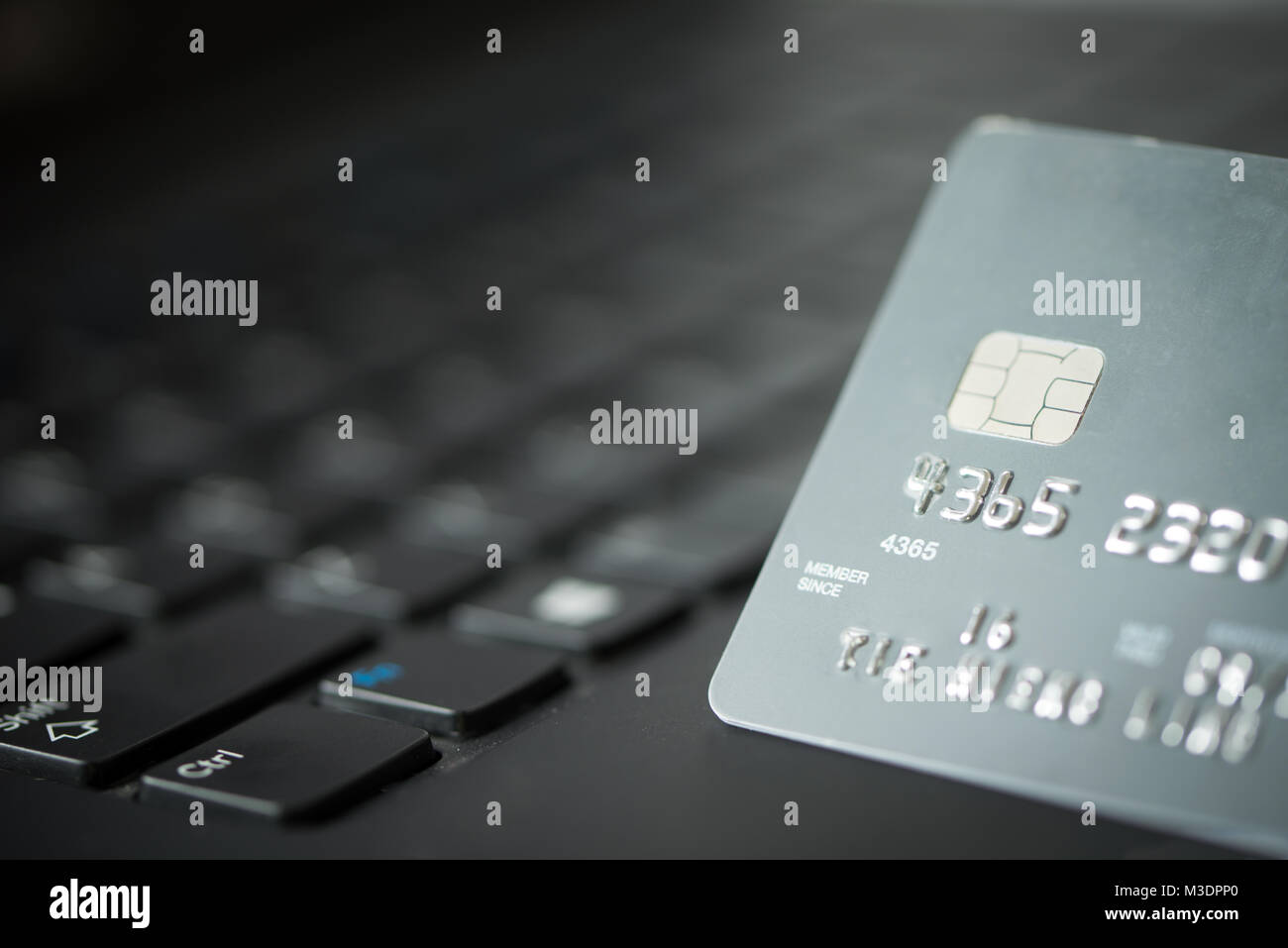 Credit card on laptop Stock Photo - Alamy