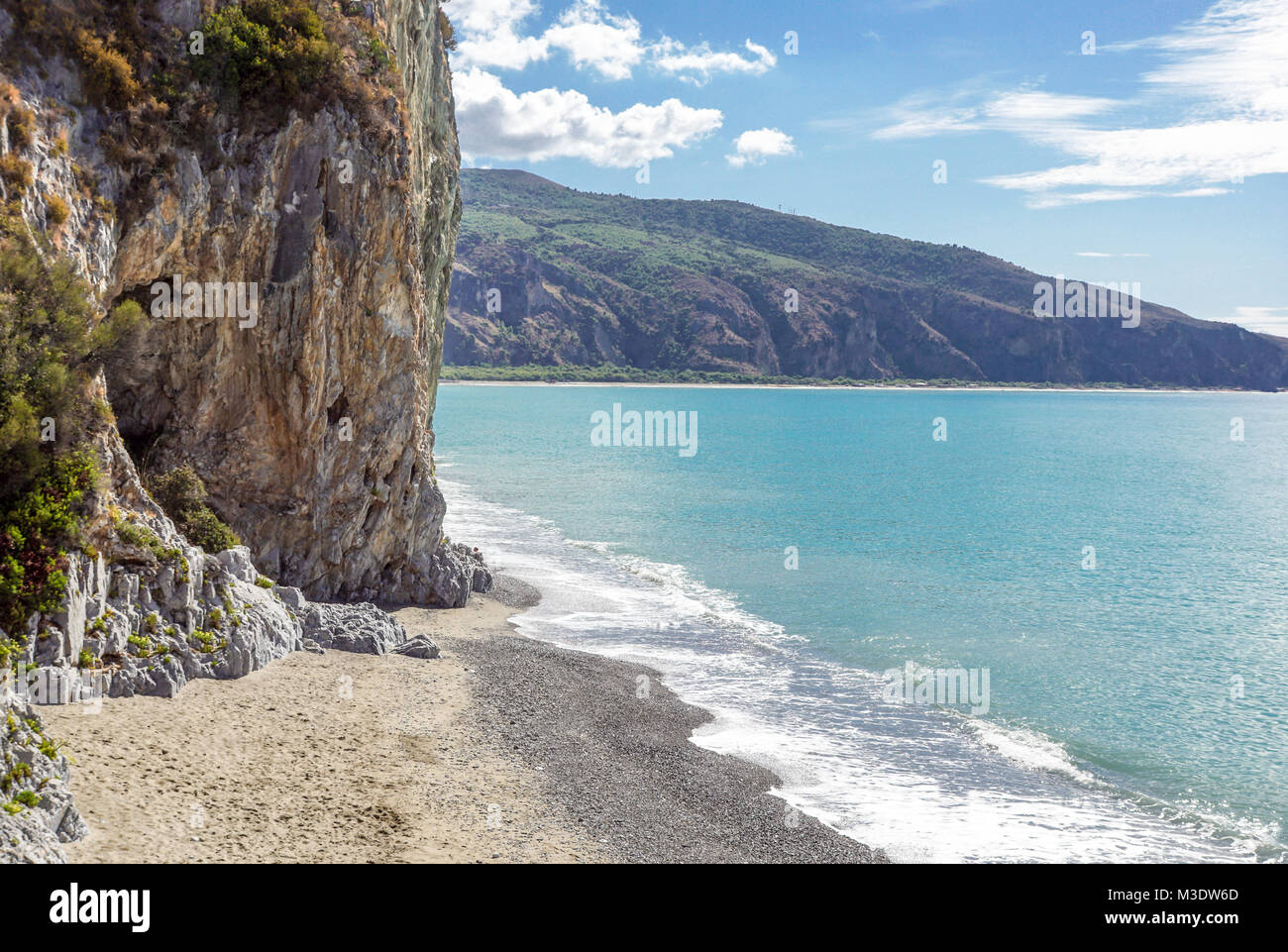tall sharp cliff shooted from the water near at beach Stock Photo - Alamy