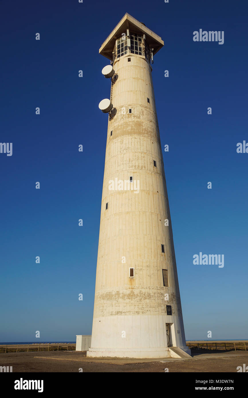 sunny morning the lighthouse of Morro Jable in Fuerteventura island ...