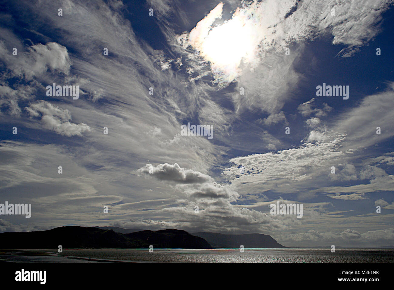 Dramatic brightly lit clouds over the North Wales coast at Llandudno ...
