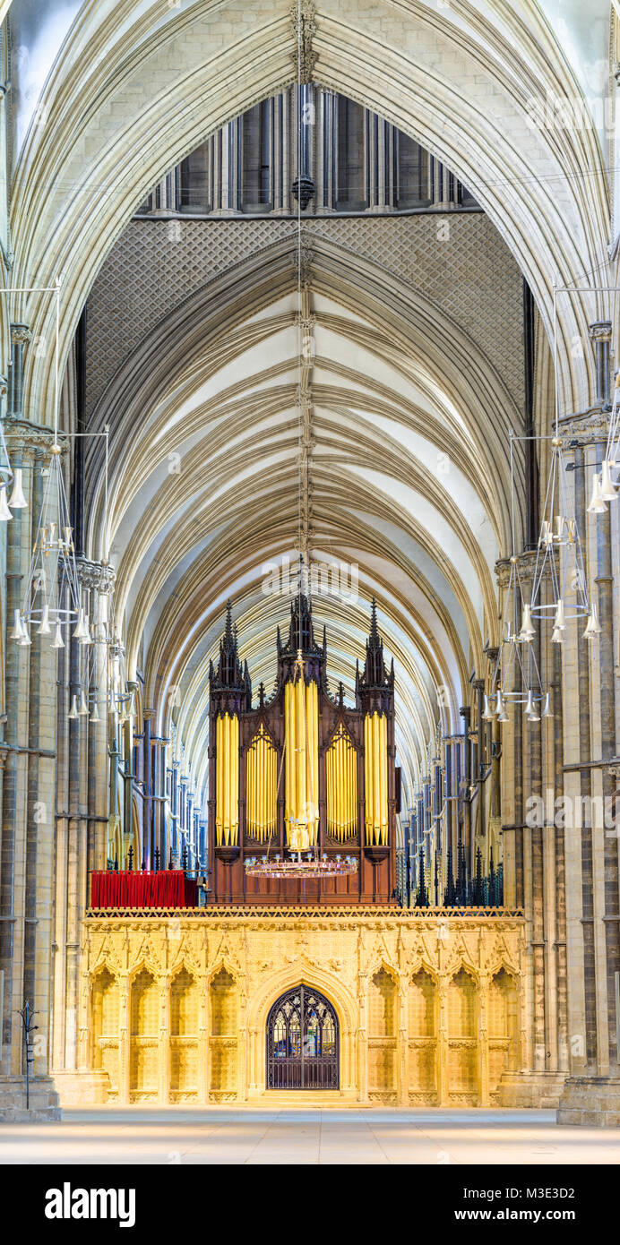 The majestic decorated stone rood screen (with organ pipes above it ...