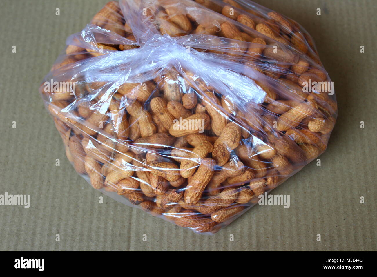 Roasted Groundnuts with shells in polythene bag Stock Photo - Alamy