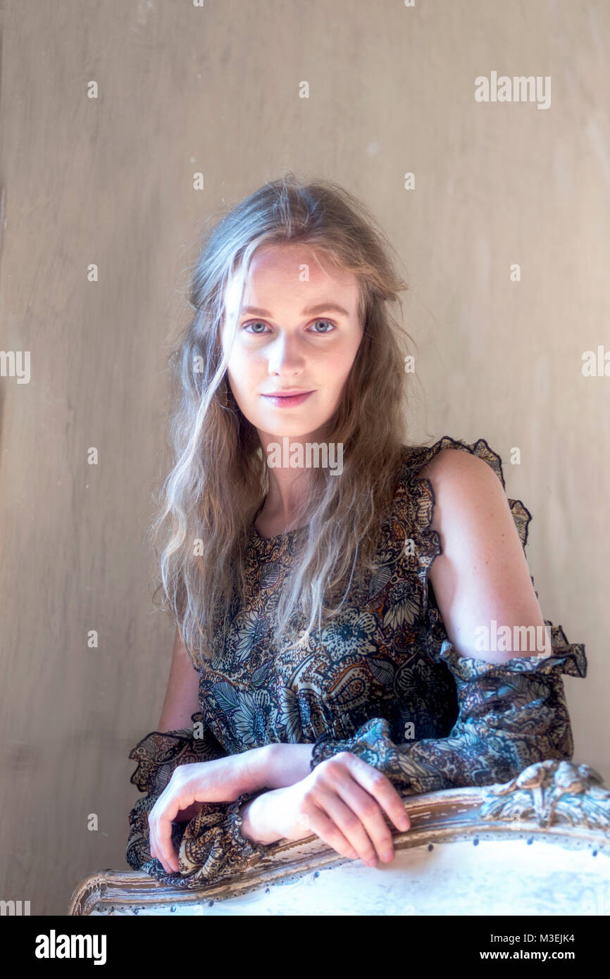 Beautiful waifish young woman looking towards camera Stock Photo - Alamy