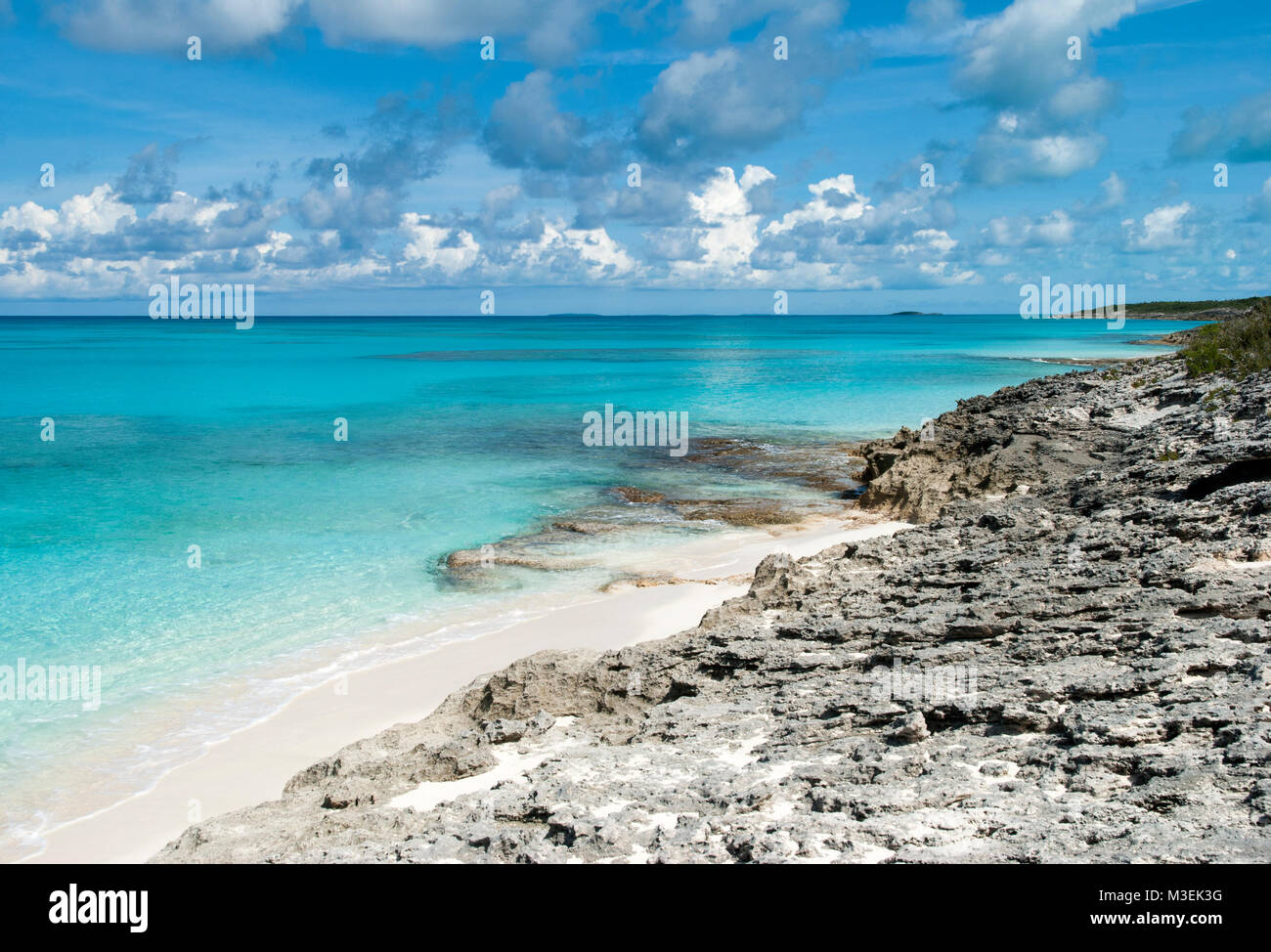 The scenic view of a rocky beach on uninhabited island Half Moon Cay ...