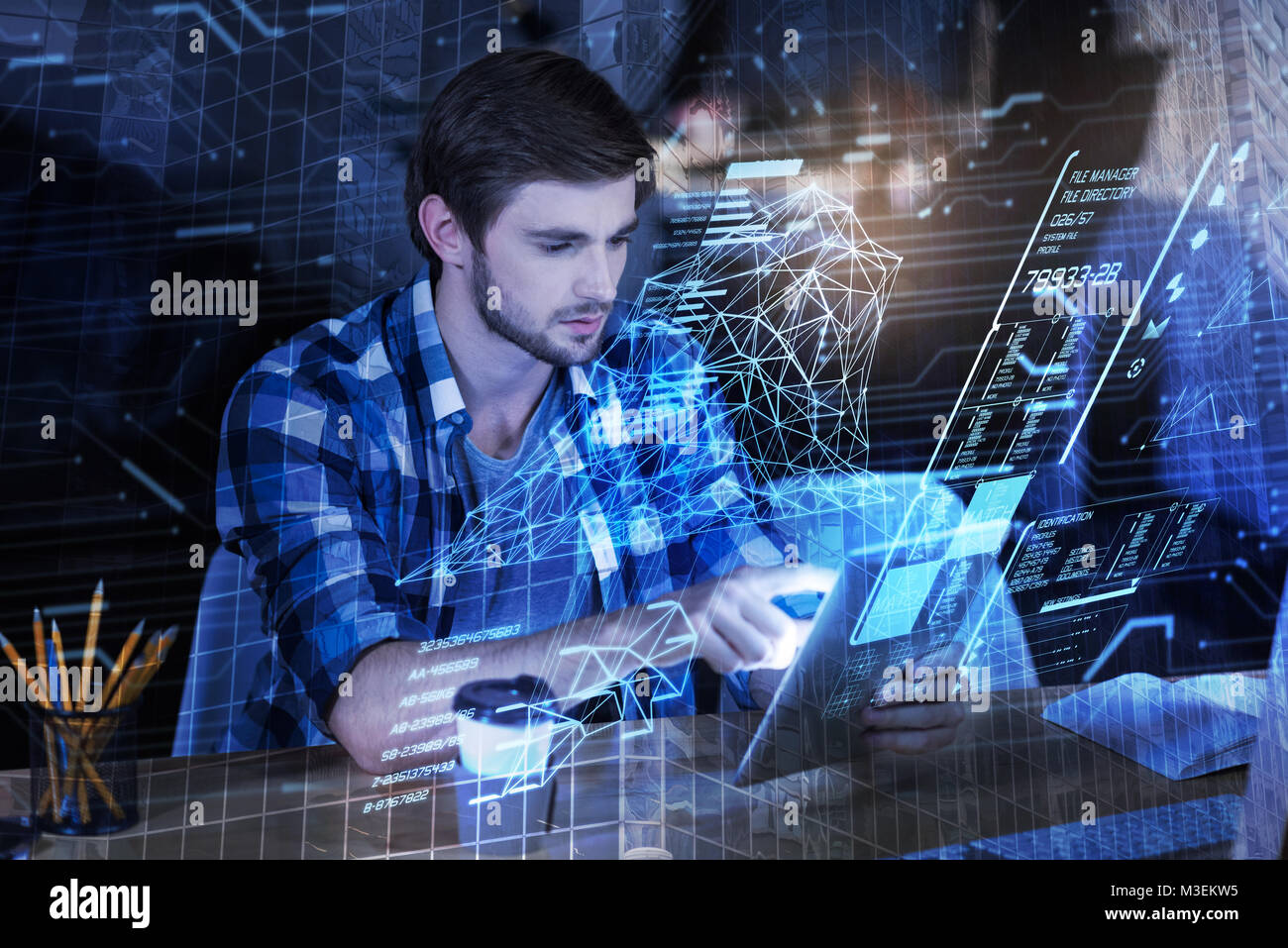 Young programmer looking tablet hi-res stock photography and images - Alamy