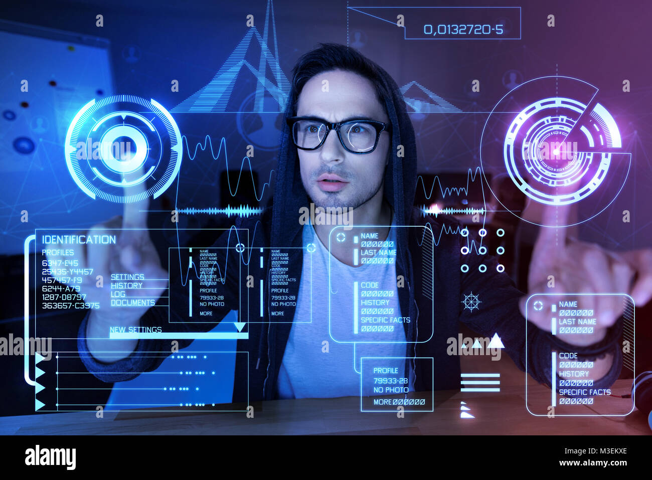Enthusiastic programmer touching the transparent screen Stock Photo - Alamy Enthusiastic programmer touching the transparent screen Stock Photo - Alamy