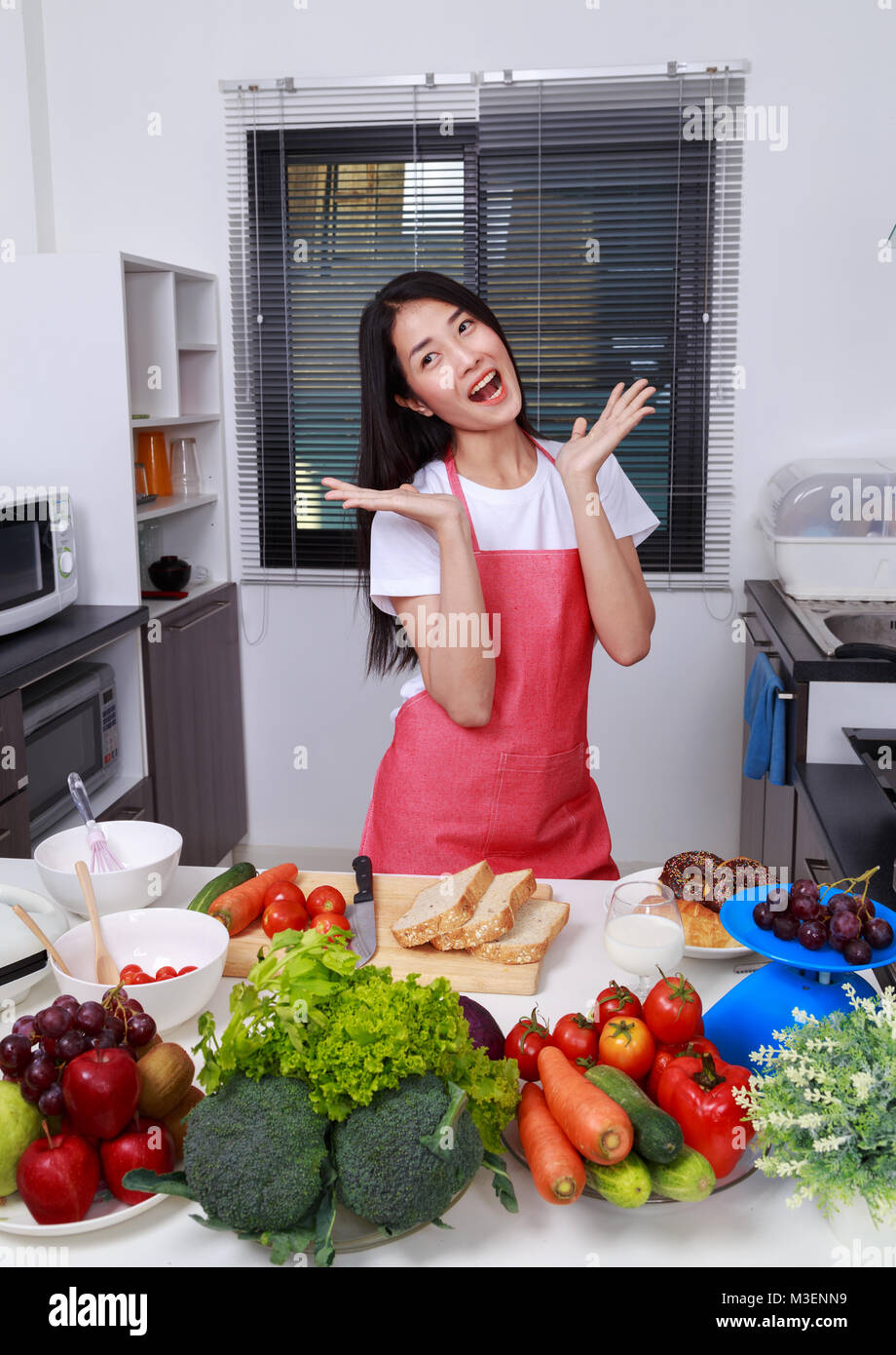 happy woman cooking in kitchen room at home Stock Photo - Alamy