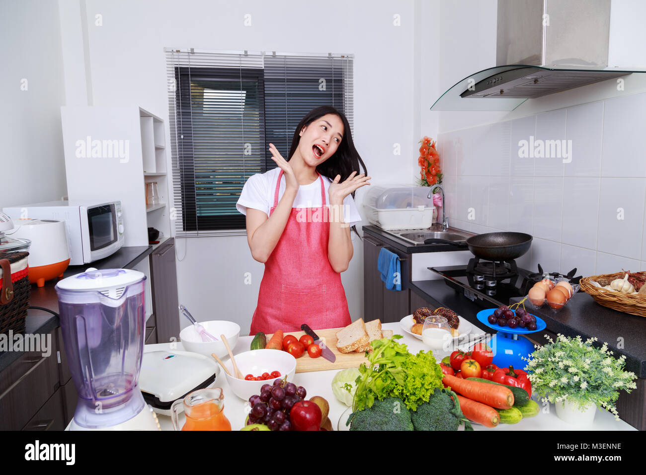 happy woman cooking in kitchen room at home Stock Photo - Alamy