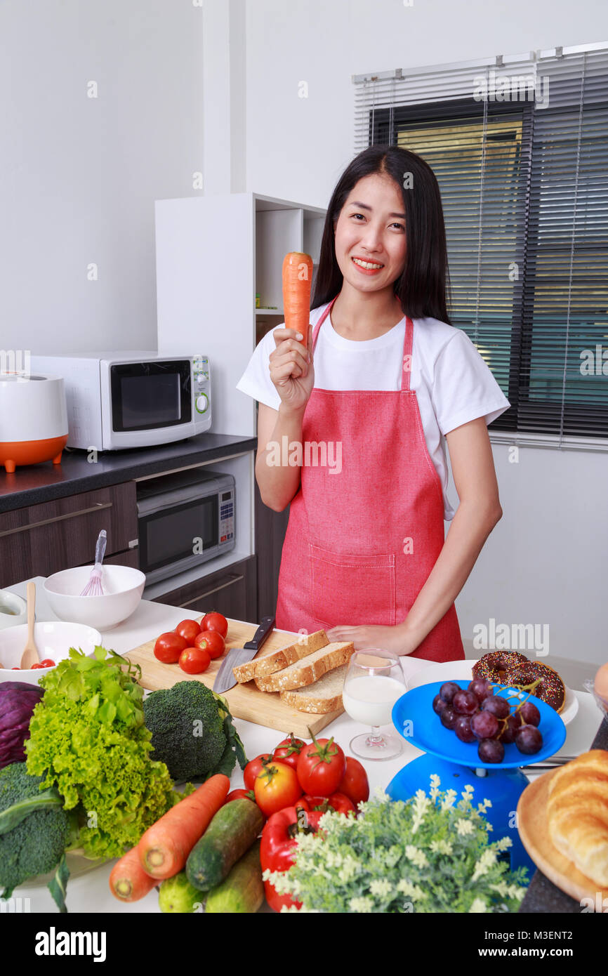 Woman cooking carrots in hi-res stock photography and images - Alamy
