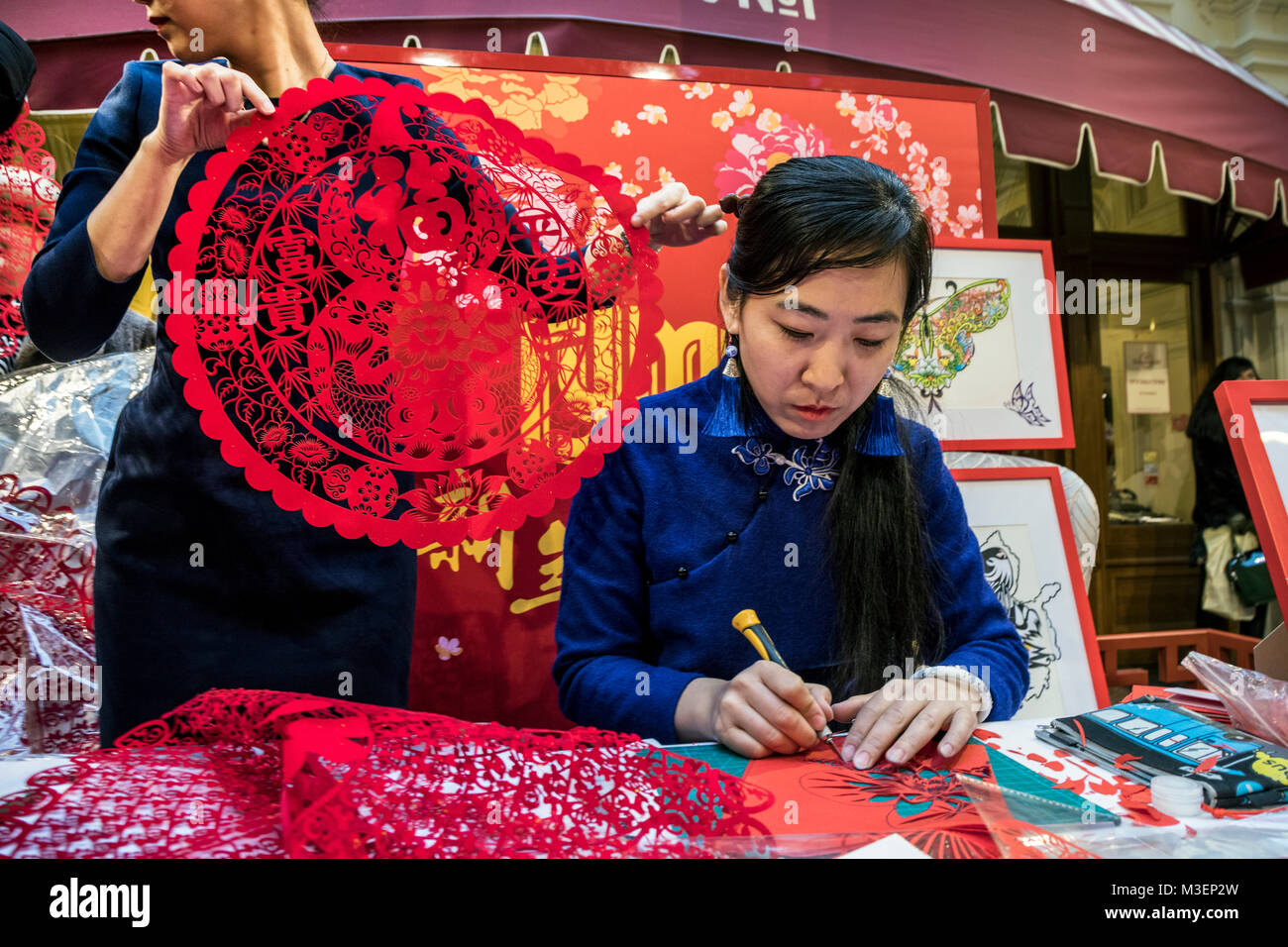 A chinese master is engaged in Jianzhi folk art - traditional folk decorative Chinese paper ...