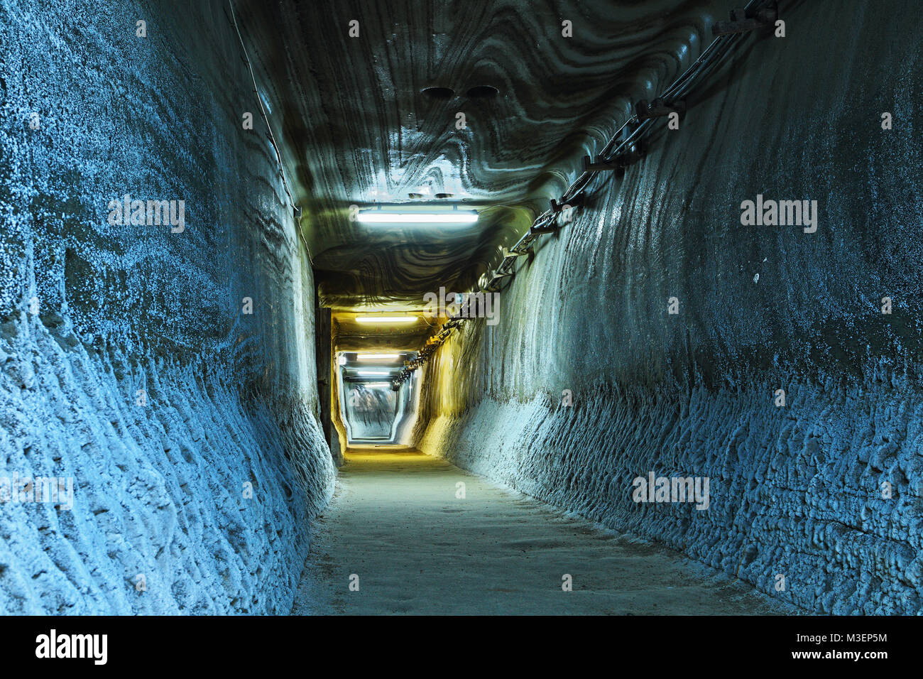 illuminated tunnel in salt mine, blue light Stock Photo - Alamy