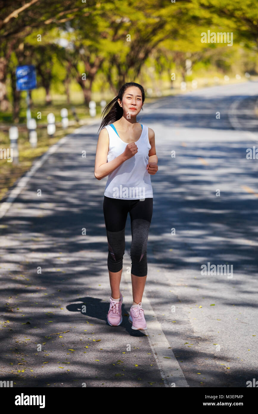 fitness woman running in the park Stock Photo - Alamy