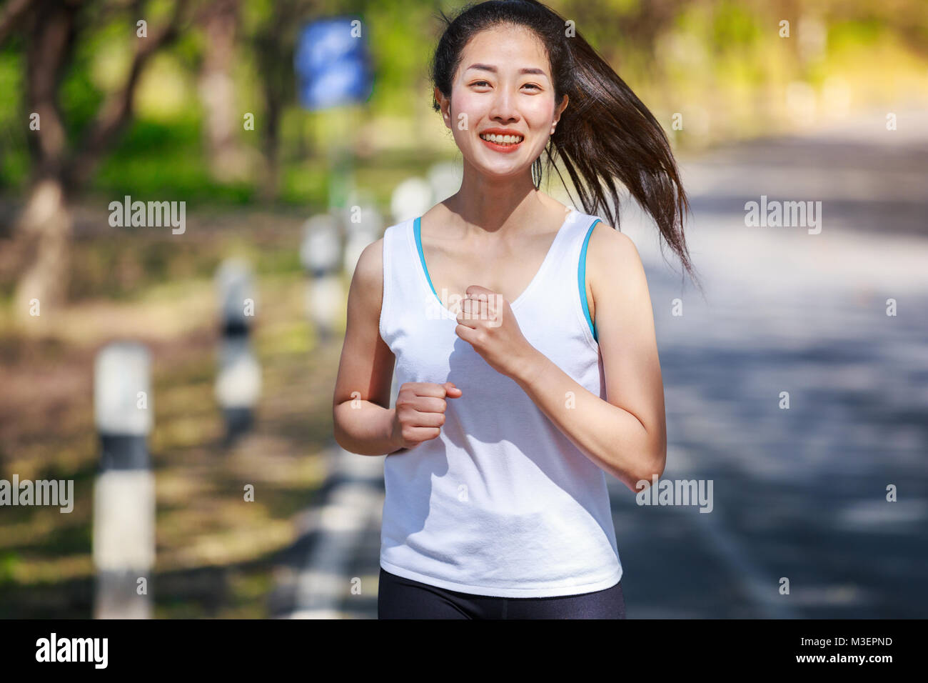 fitness woman running in the park Stock Photo - Alamy