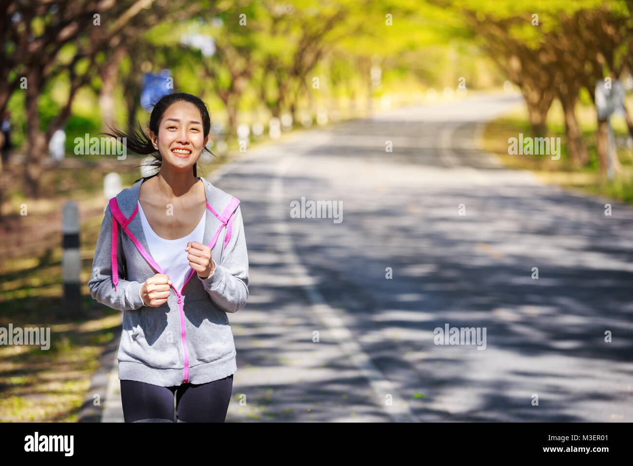 fitness woman running in the park Stock Photo - Alamy