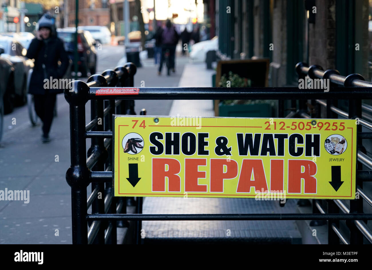 Shoe and Watch repair sign on a basement entrance on sidewalk in Soho ...