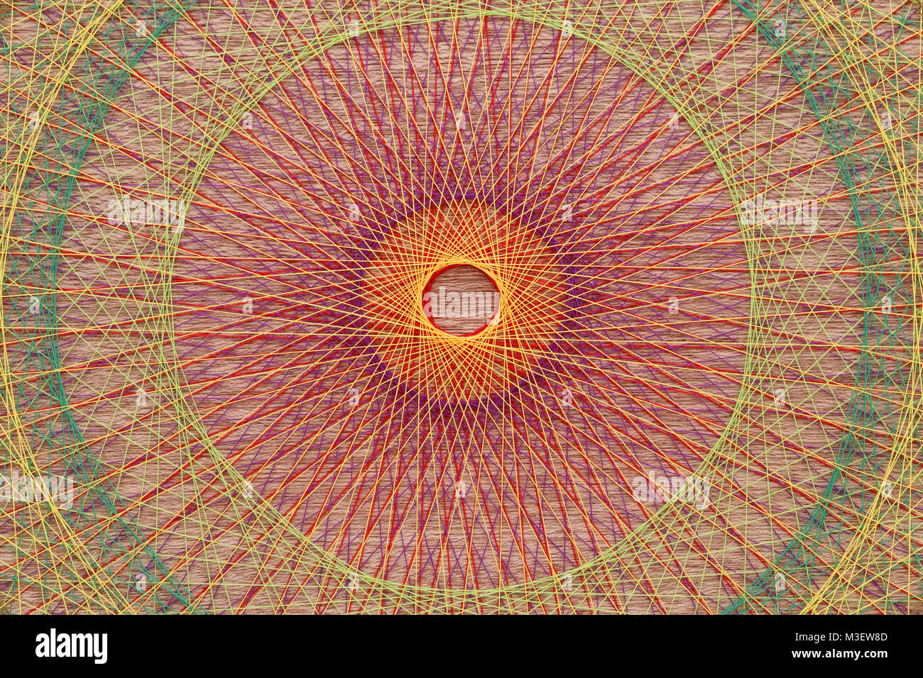 Braid with colorful strings, folk handicraft art Stock Photo - Alamy