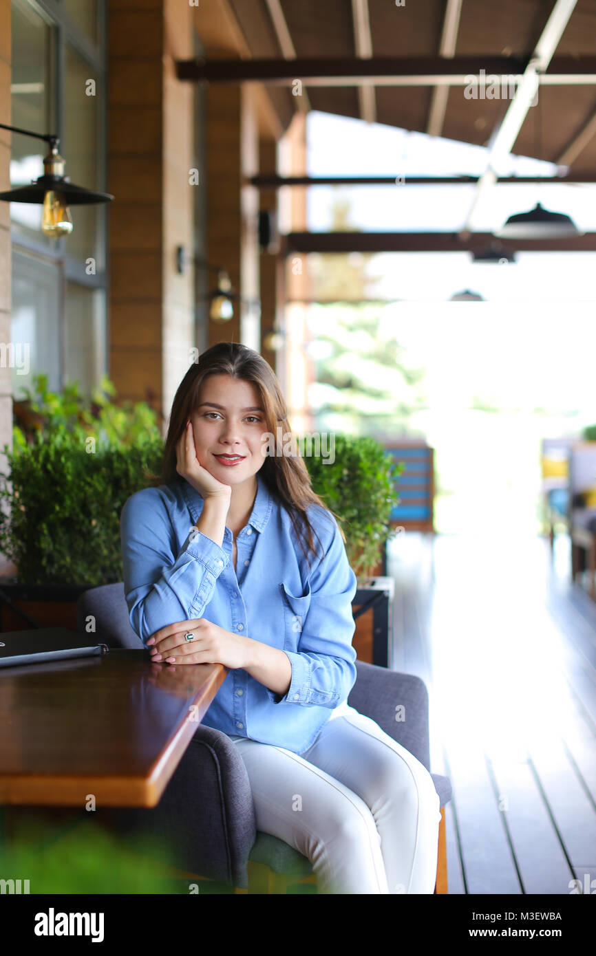 Beautiful girl reading diary at cafe Stock Photo - Alamy