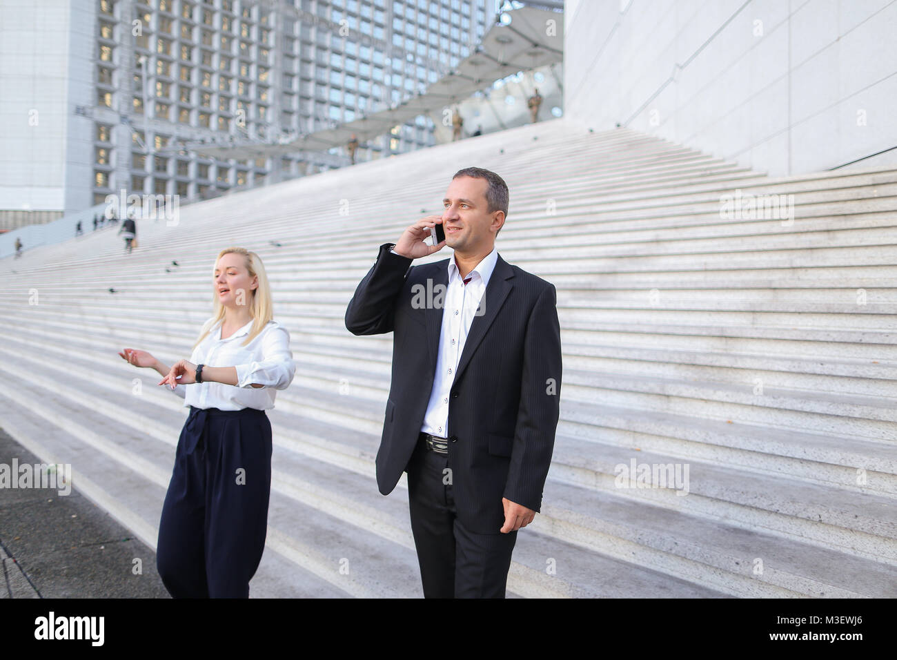 Foreign business colleagues in official journey talking and keep Stock ...