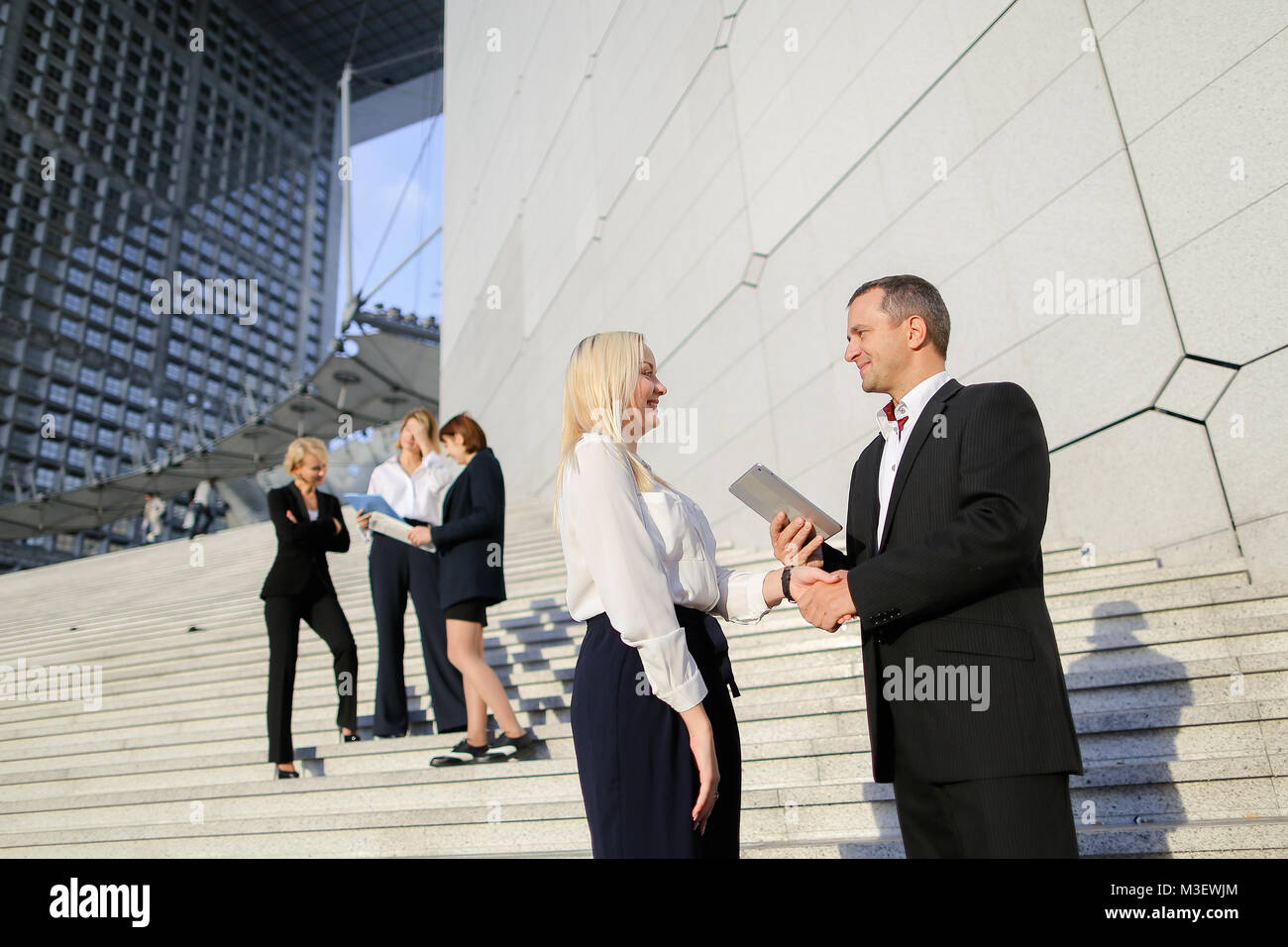 Foreign business colleagues in official journey talking and keep Stock ...