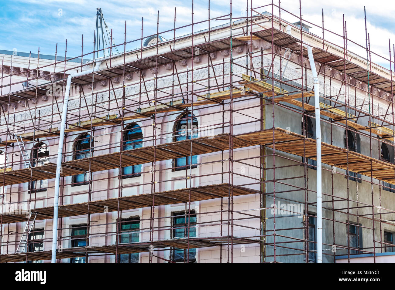 scaffolding on wall of the building for restoration work and renovation ...