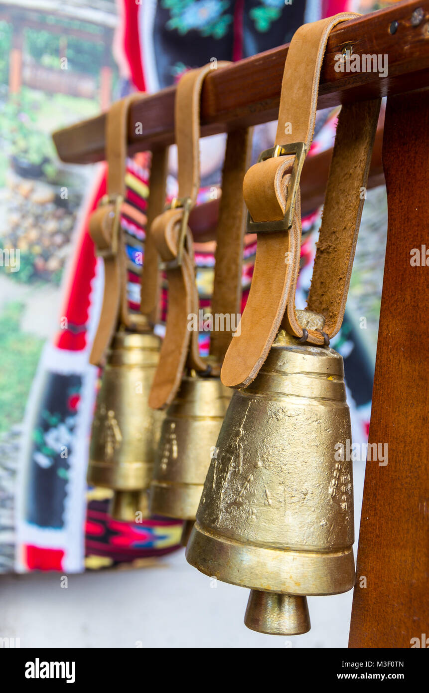 Animal bell hanging on a pole as a decoration Stock Photo - Alamy
