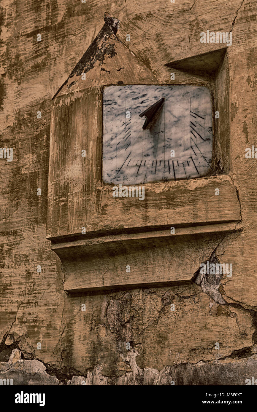 and the gnomon in the antique broken wall Stock Photo - Alamy