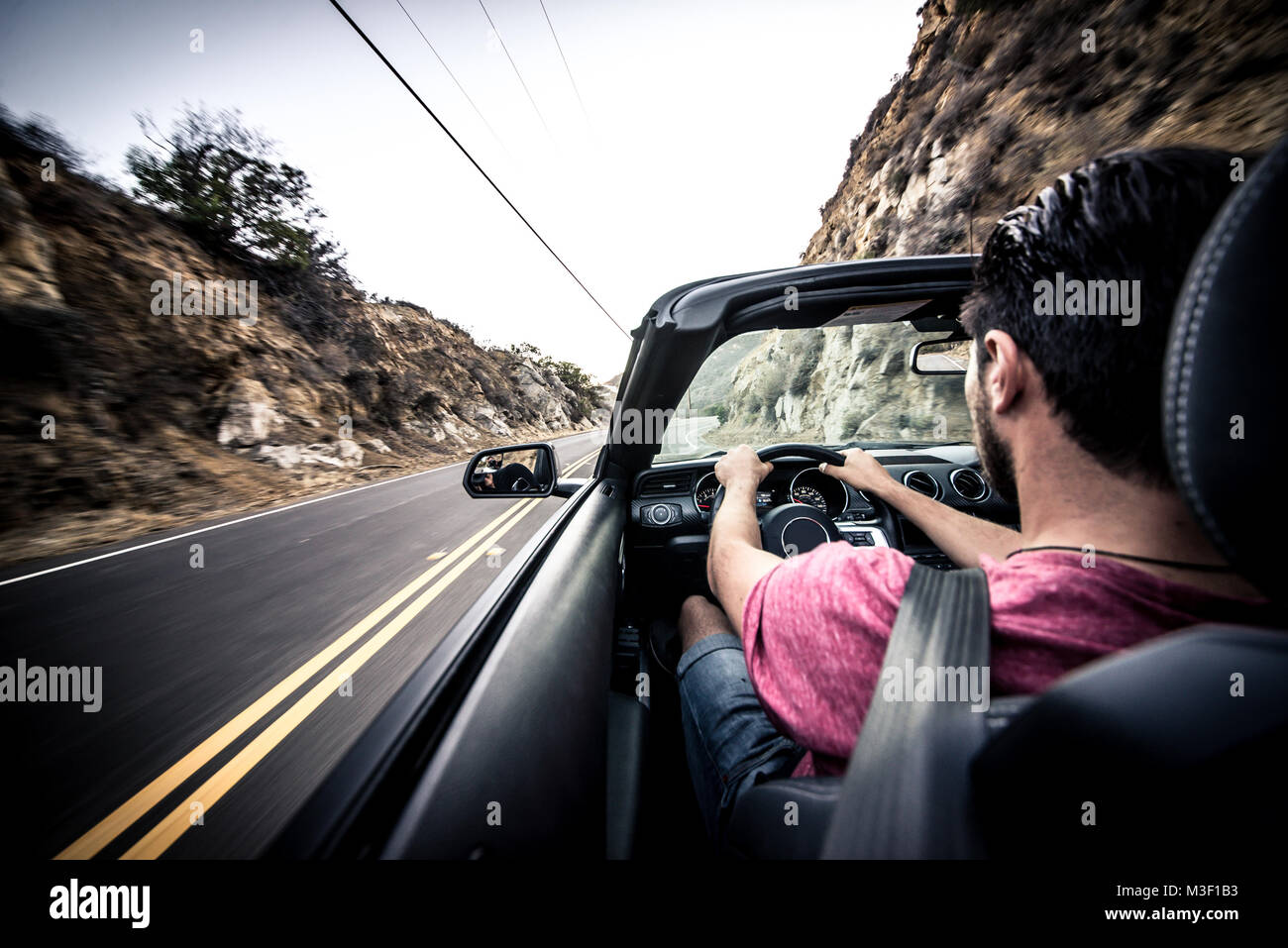 Man driving convertible car in Los angeles, santa monica Stock Photo ...