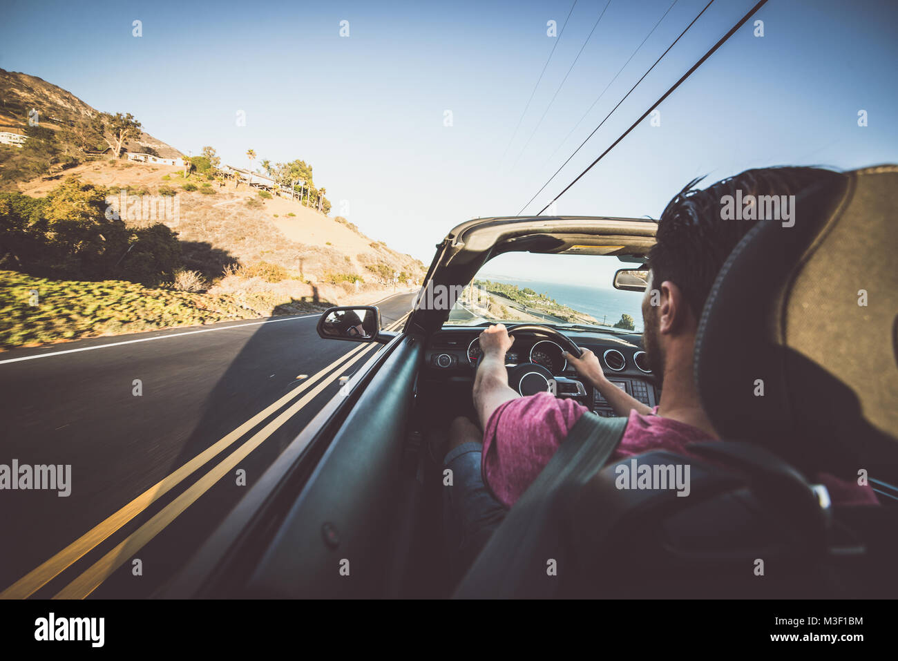 Man driving convertible car in Los angeles, santa monica Stock Photo ...