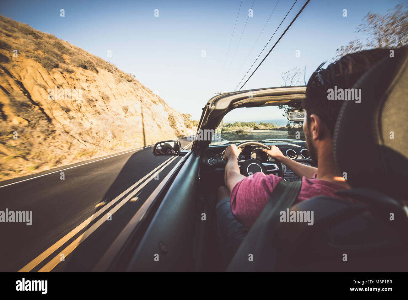 Man driving convertible car in Los angeles, santa monica Stock Photo ...