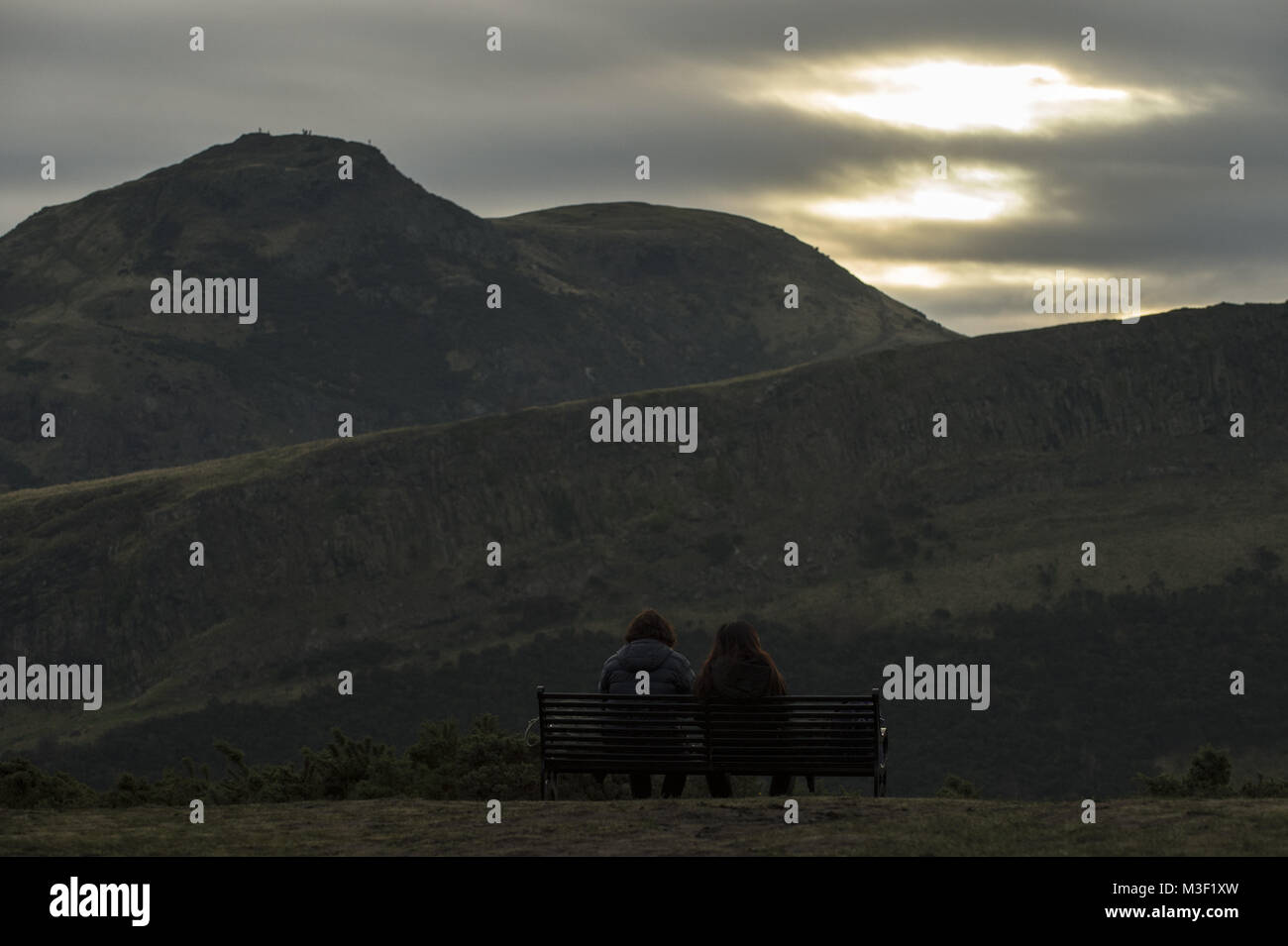 An overcast sunrise over Arthur's Seat and the Salisbury Craigs in ...