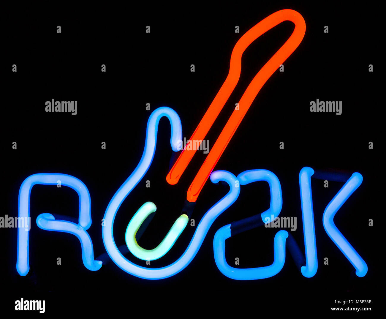 Neon rock sign in red and blue with a guitar shape against a black ...