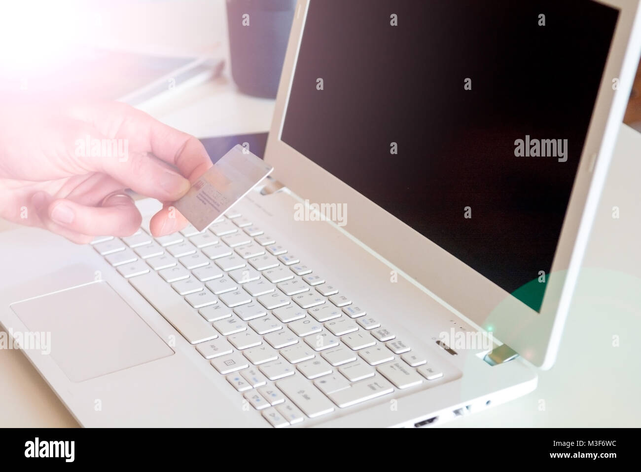 Hand holding credit card, online shopping on laptop computer Stock ...