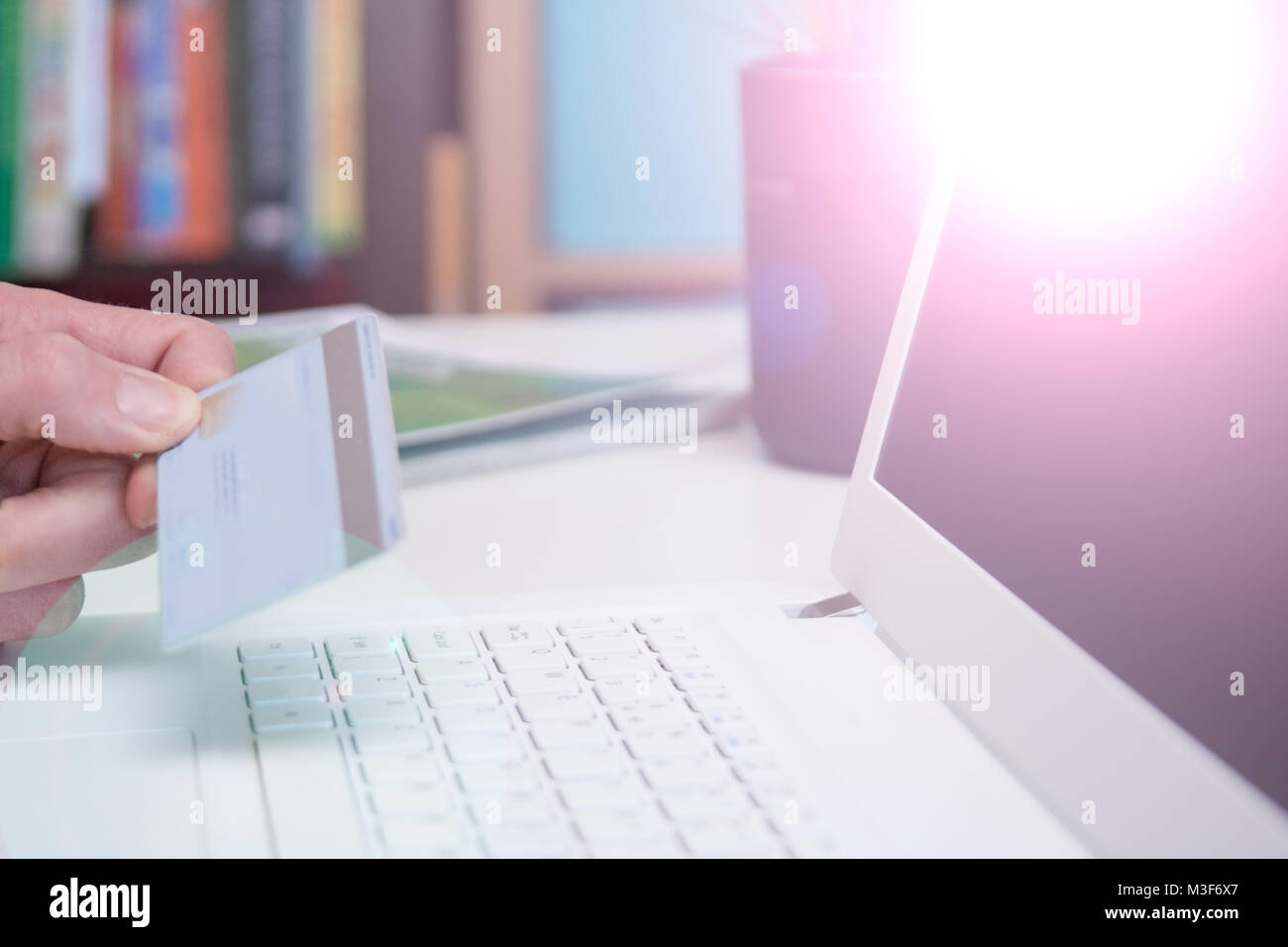 Hand holding credit card, online shopping on laptop computer Stock ...