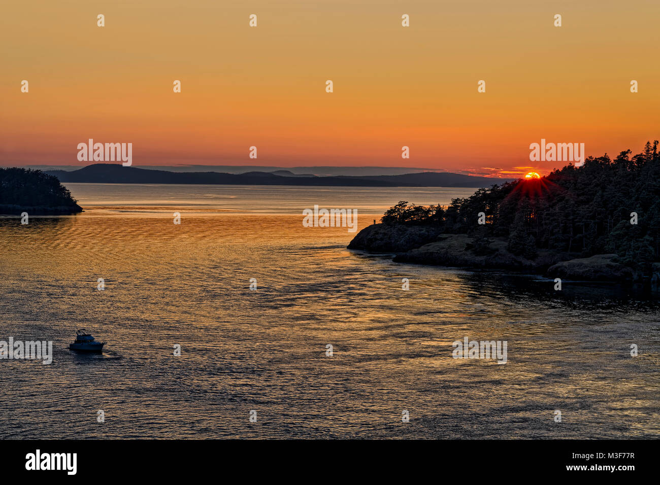 Boat in Deception Pass sunset Stock Photo - Alamy