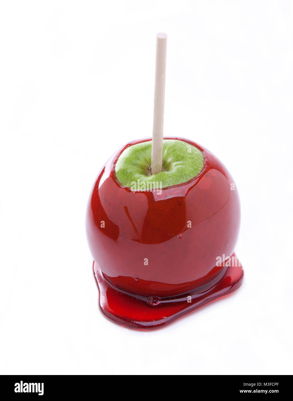 Candied apple on white background Stock Photo - Alamy