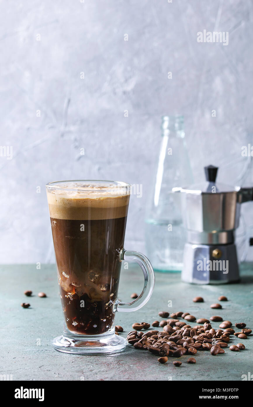 Fizzy iced Coffee espresso with milk, bottle of sparkling water, coffee ...