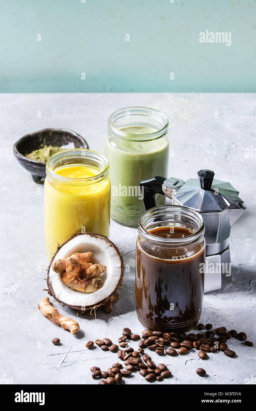 Variety of iced colorful latte drinks. Iced coffee, turmeric and matcha ...