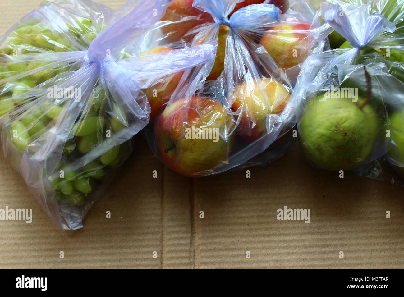 Fruits inside polythene packets Stock Photo - Alamy