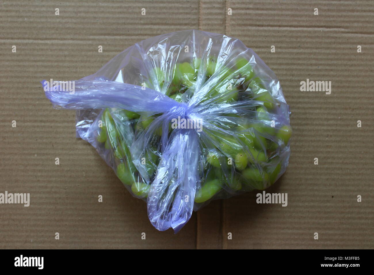 Green packet hi-res stock photography and images - Alamy