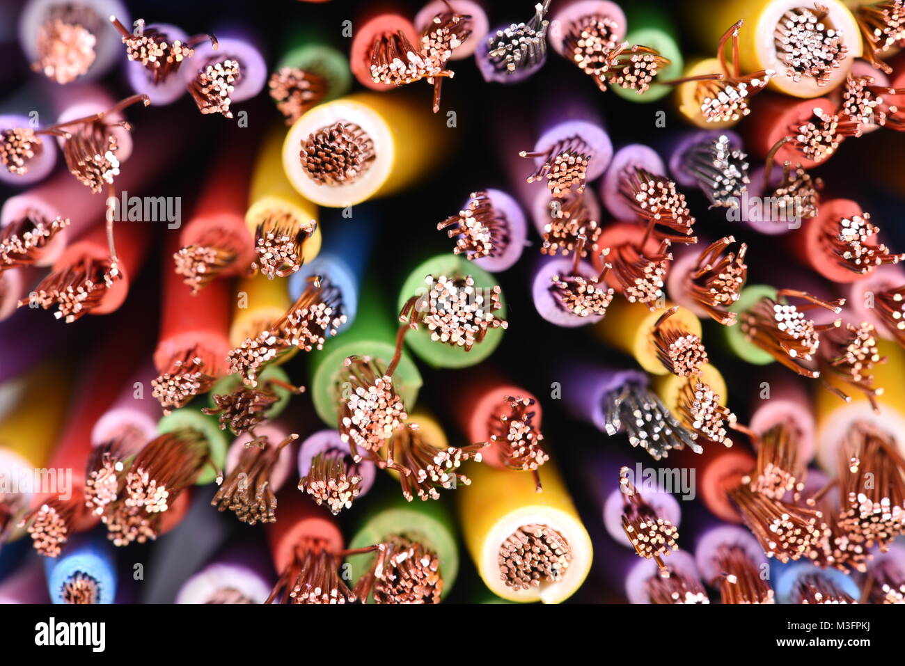 Colored copper electic cables closeup on metal surface with reflexion ...